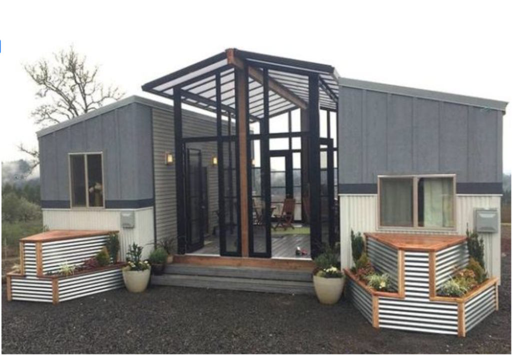 Family's home is two tiny houses connected with a central sun room & deck